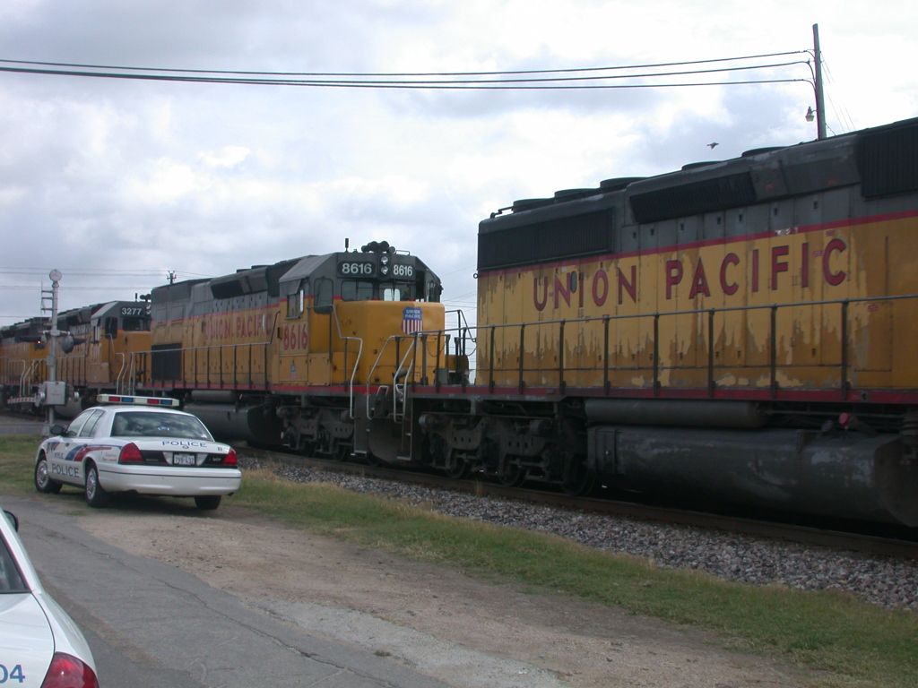 UP 8616 23Aug2004 Numbers two and three in a six-unit NB lashup with aggragate crossing Center ...